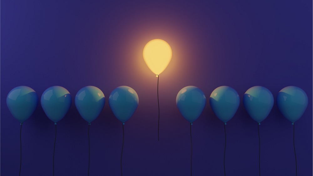 Stand out concept with glowing balloons | Documedia Group